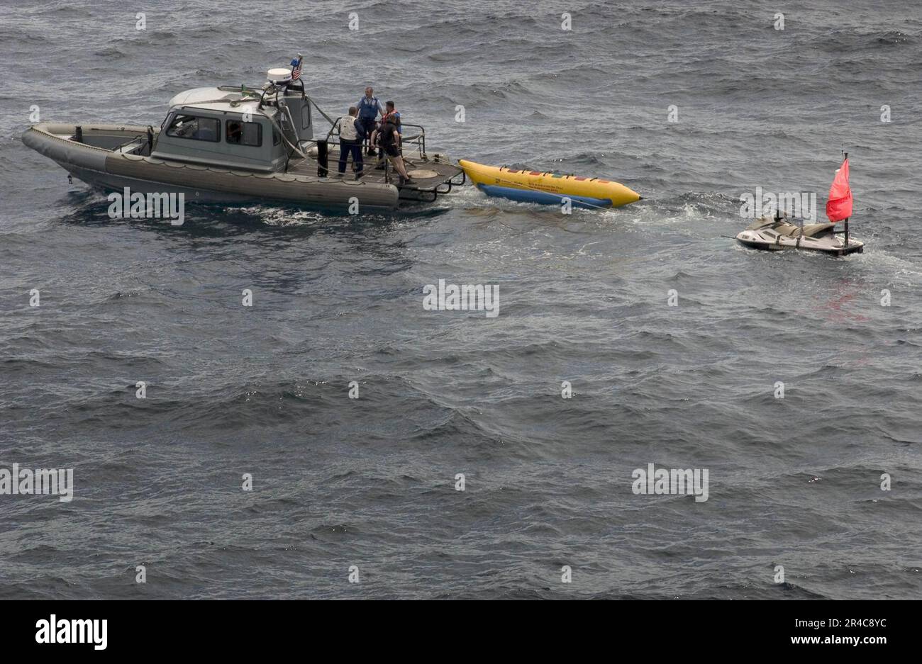 US Navy Sailors aboard a Rigid Hull Inflatable Boat (RHIB) assigned to ...