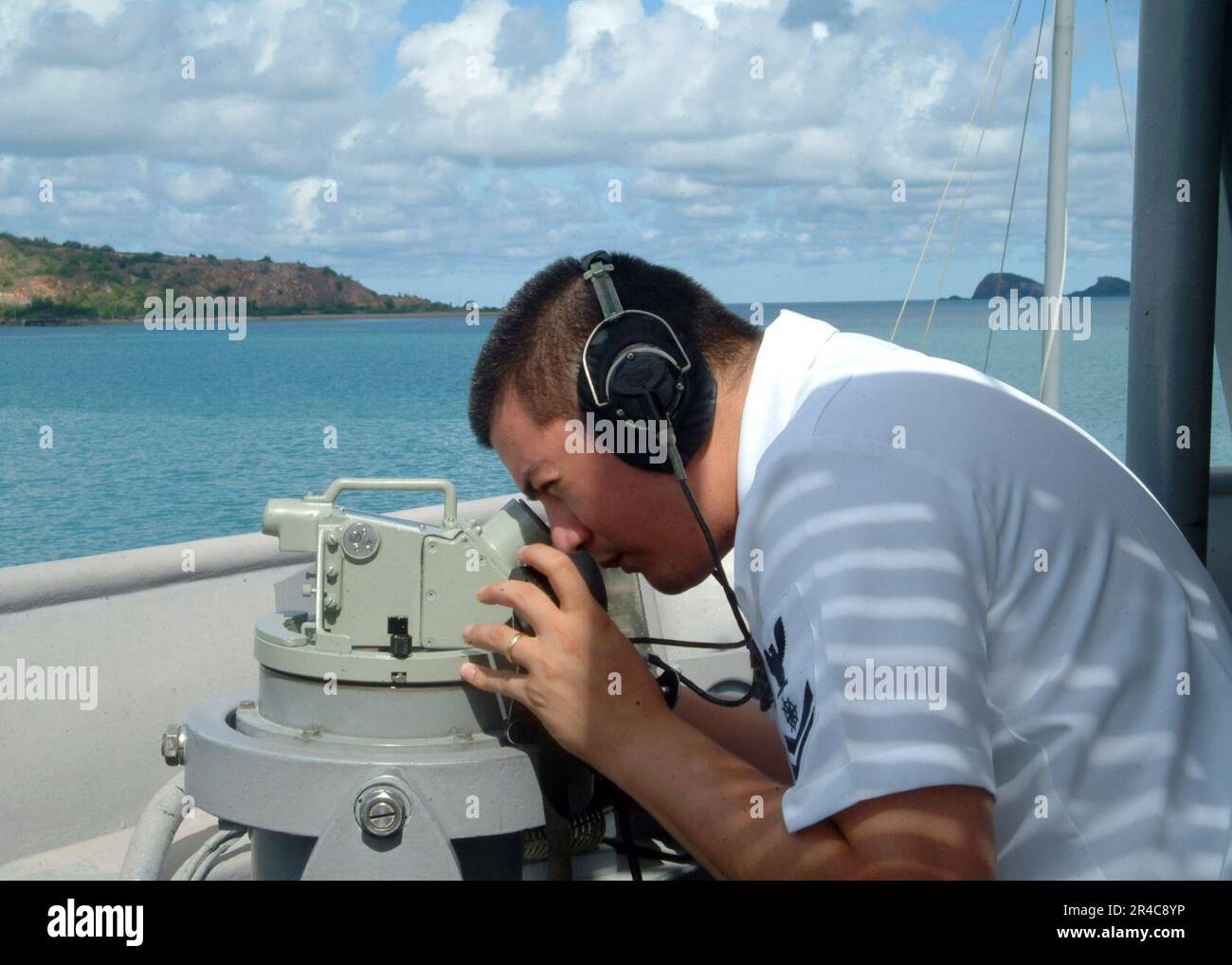 US Navy Quartermaster 2nd Class takes bearings reading aboard the ...