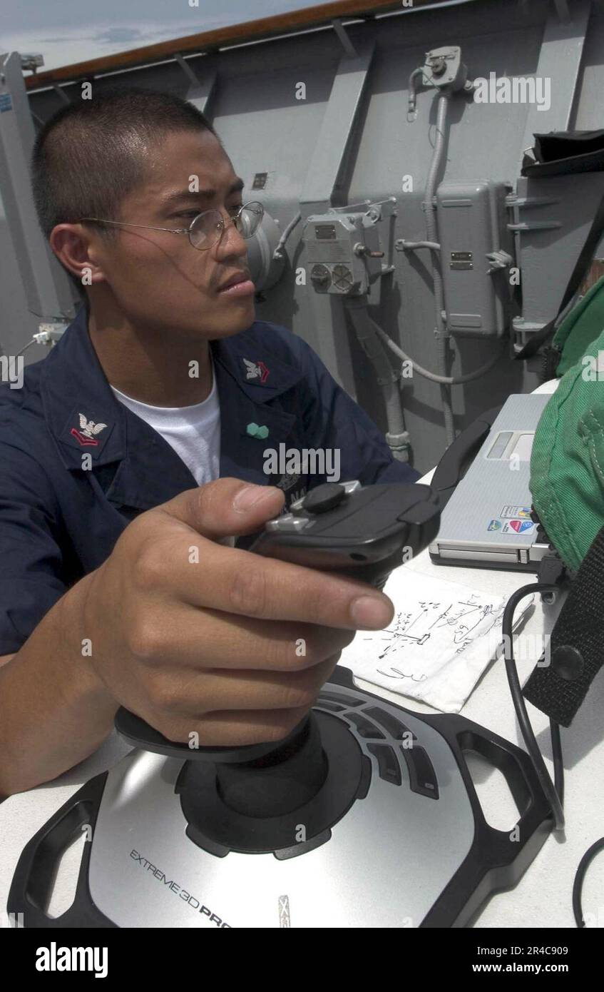US Navy Aviation Machinist's Mate 2nd Class controls a ship Deployed ...