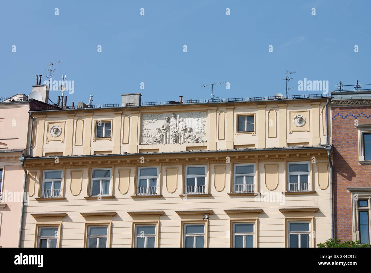 The building in Poland with white facade, large glass windows and ...