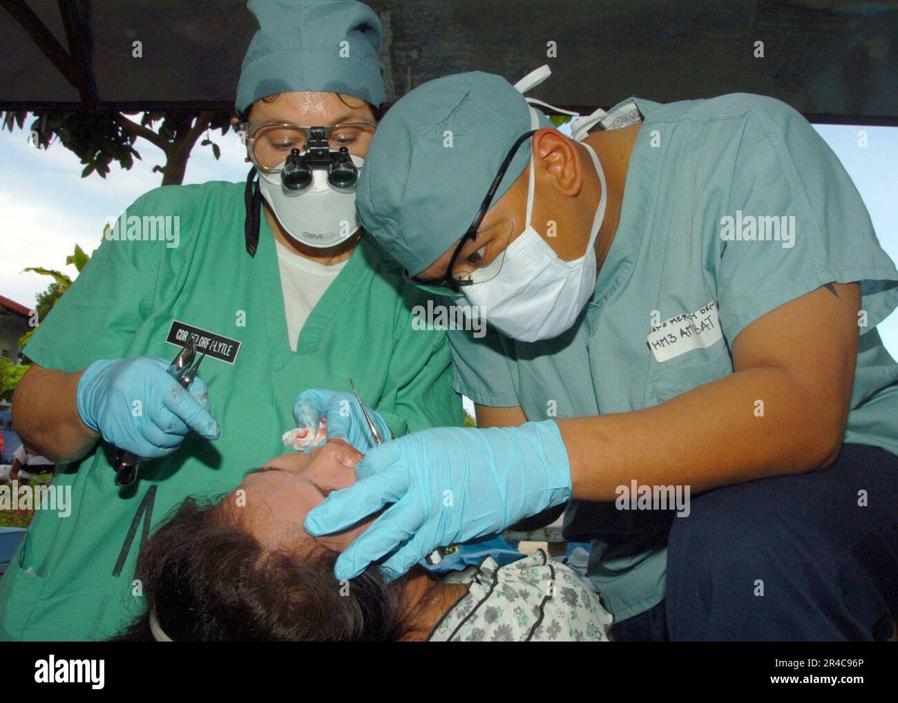 US Navy U.S. Navy Dentist Cmdr. left, and Hospital Corpsman 3rd Class ...