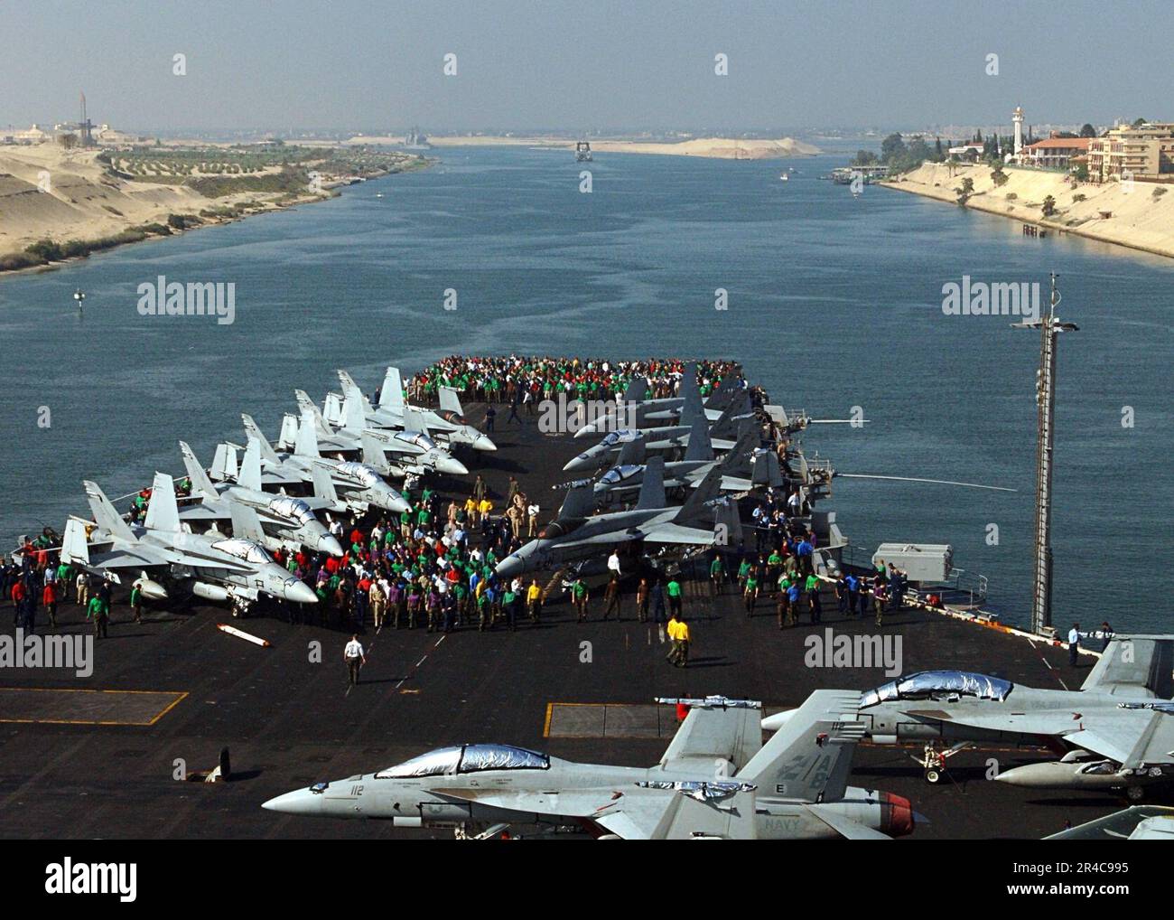 US Navy Crew members gather on the bow for a Foreign Object Damage (FOD ...