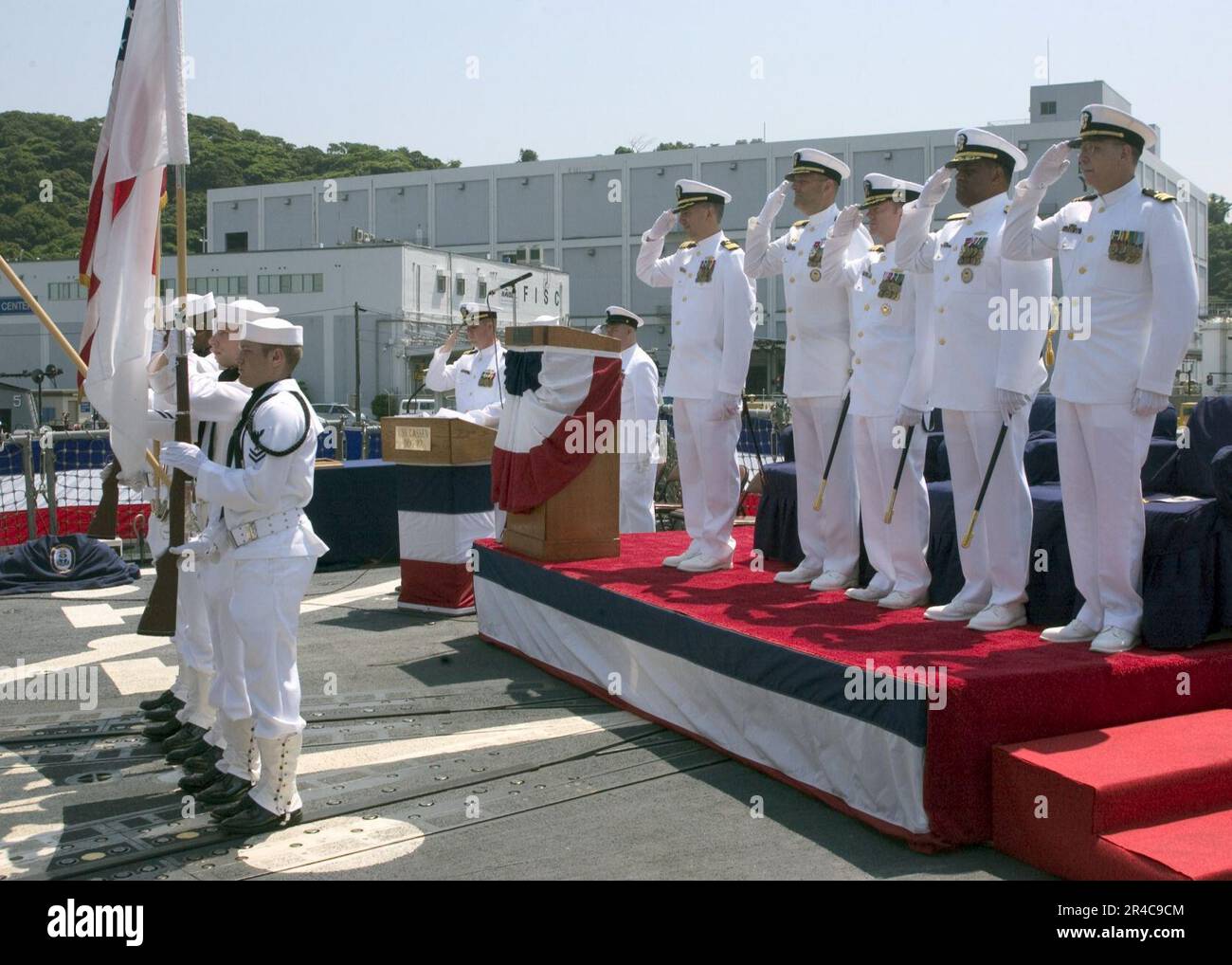 US Navy The official party salute the parading of the colors during the ...
