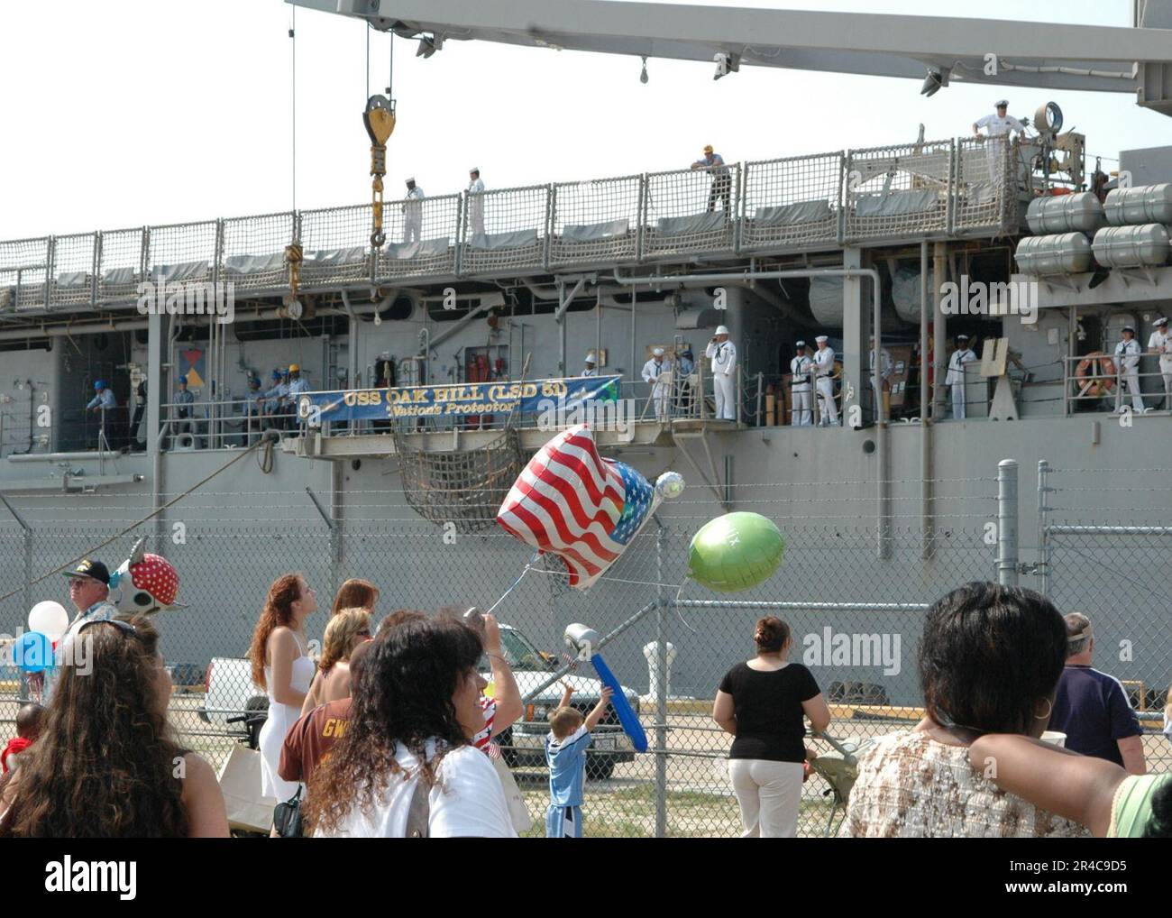 US Navy Family members welcome home the Sailors of the amphibious dock ...