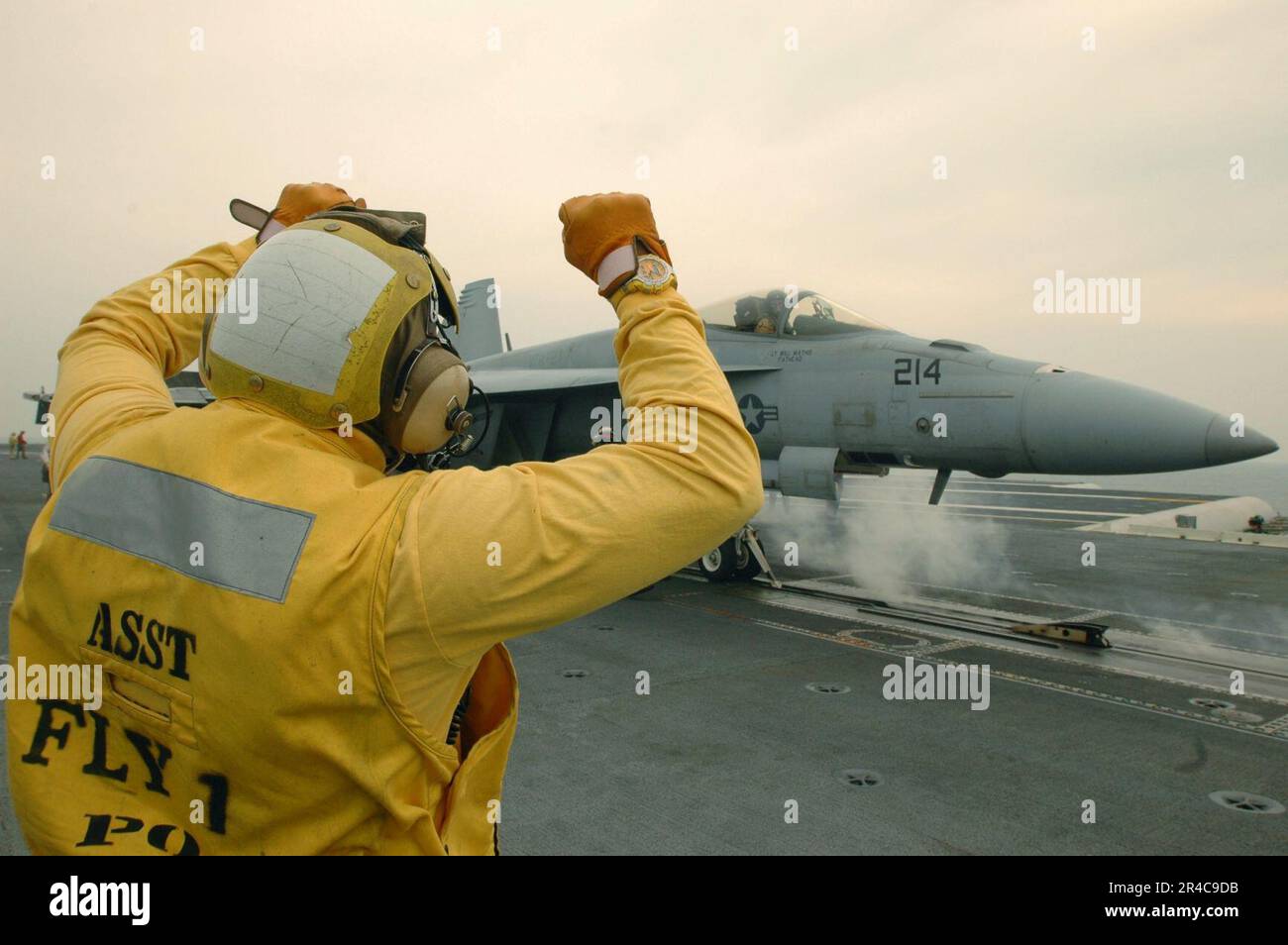 US Navy An aircraft director signals to an F-A-18E Super Hornet ...