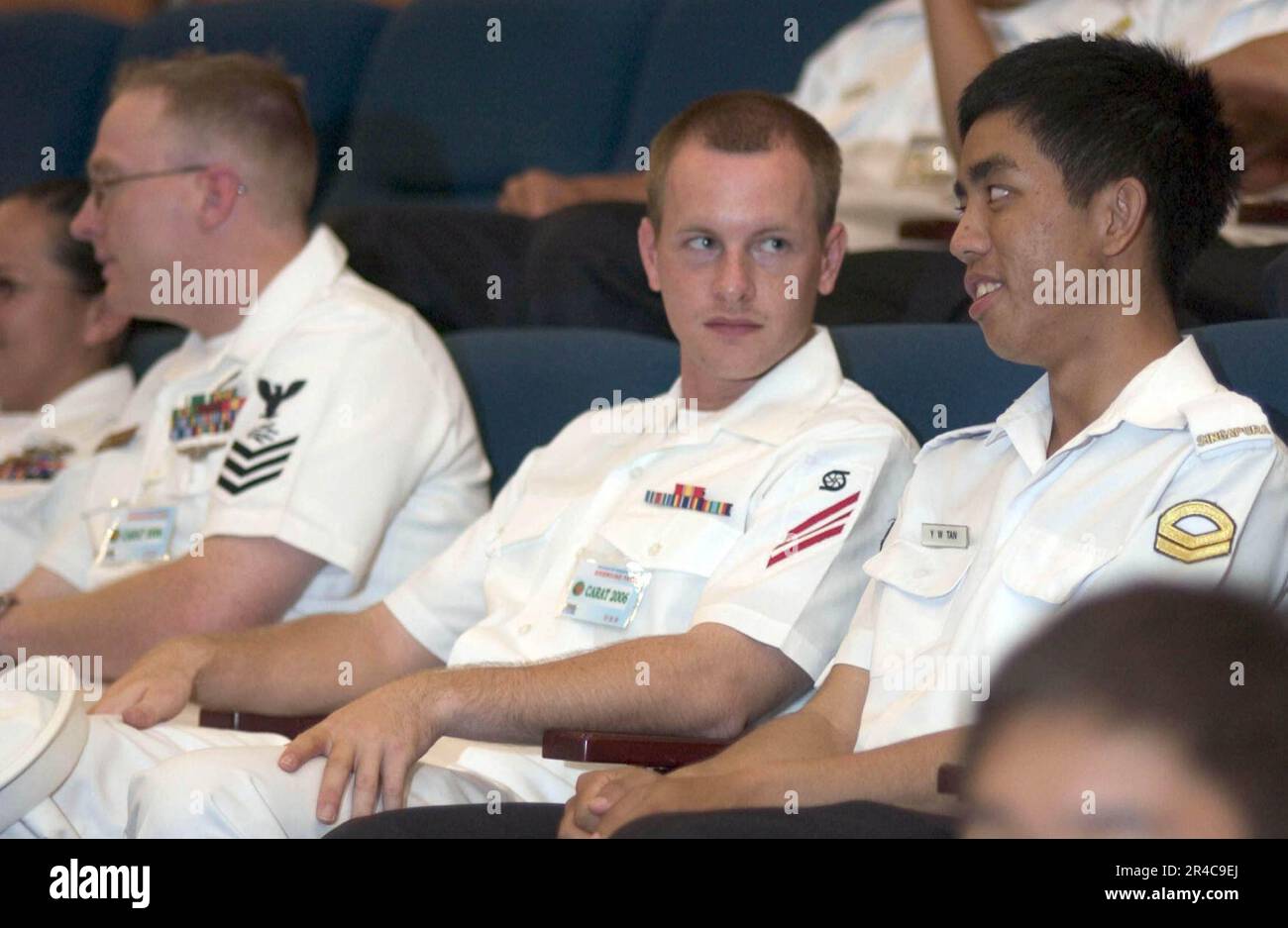 US Navy Republic of Singapore Navy Sailors and U.S Navy Sailors sit ...