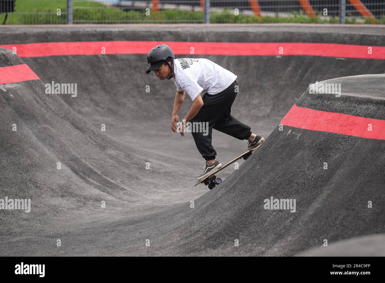 Shenyang. 27th May, 2023. A man plays skateboard on the track of ...