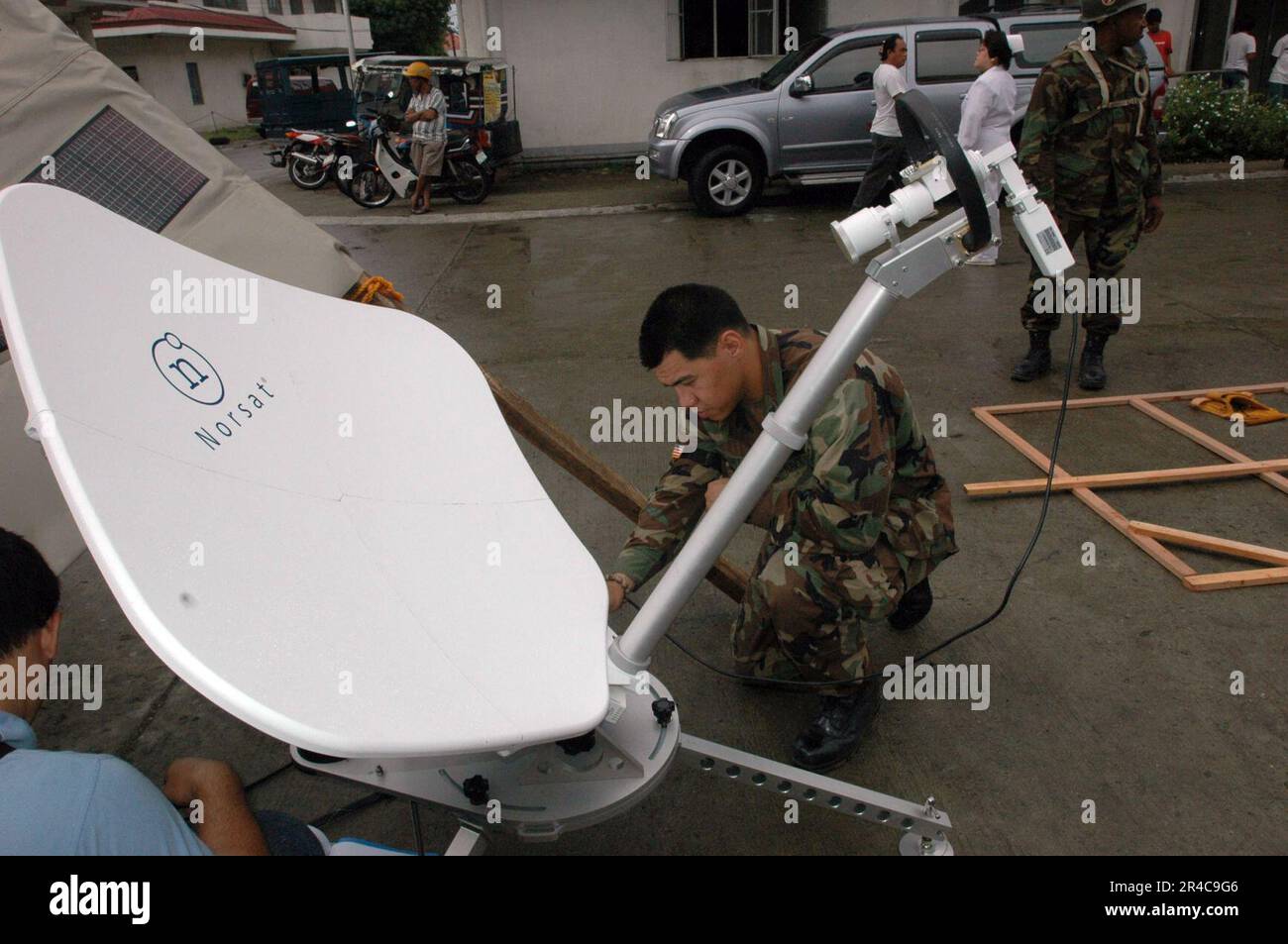US Navy Navy Petty Officer 2nd Class assembles a high-frequency ...
