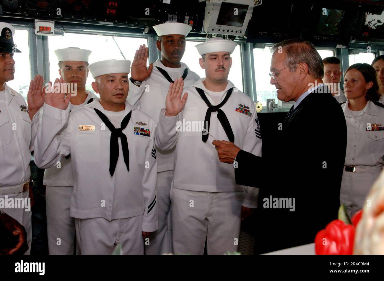US Navy Secretary of Defense Donald H. Rumsfeld reenlists four Sailors ...