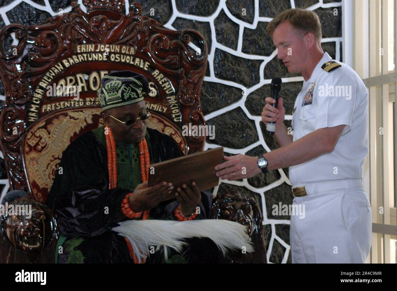 US Navy Commanding Officer USS Barry (DDG 52), Cmdr. presents the Oba ...