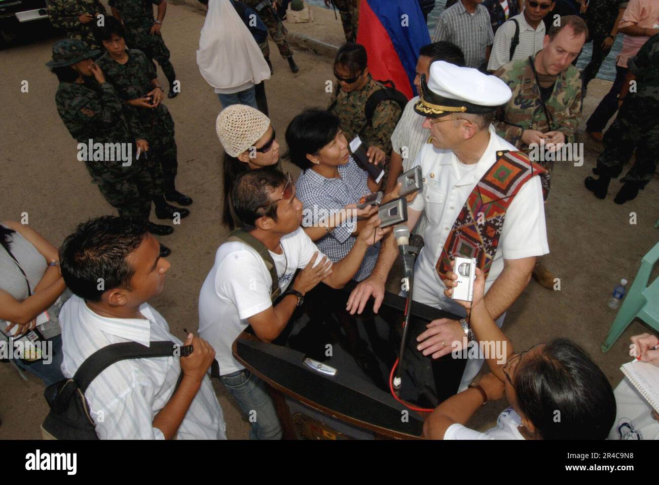 US Navy Commander, Amphibious Squadron Seven, Capt. speaks to guests ...