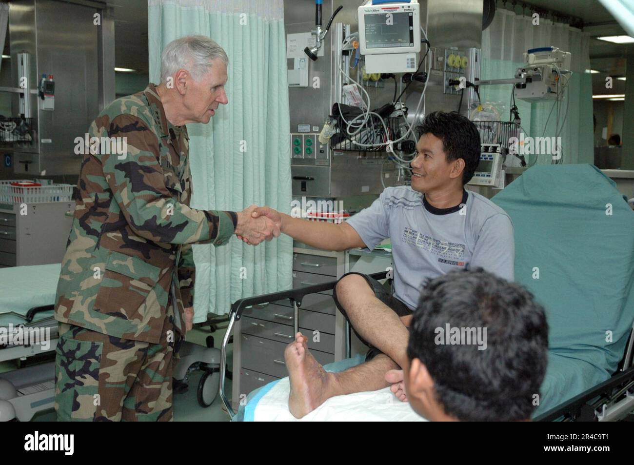 US Navy Commander, U.S. Pacific Command, Adm. William J. Fallon greets ...