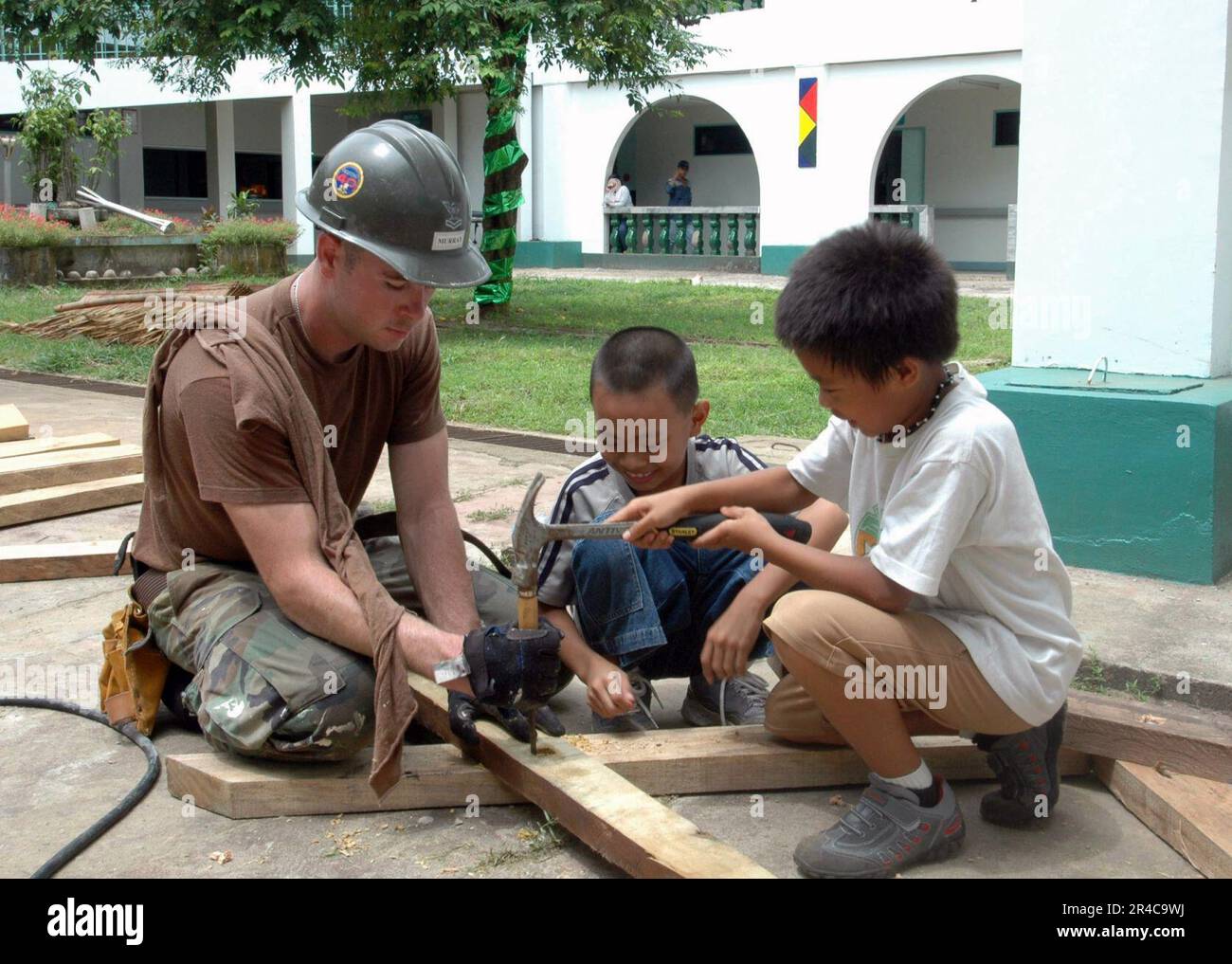 US Navy Builder 2nd Class assigned to Naval Mobile Construction ...