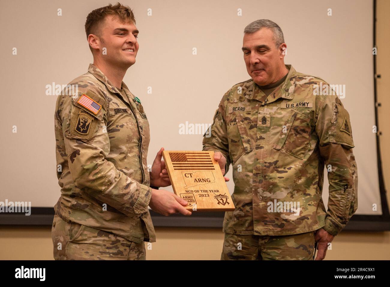 U.S. Army Staff Sgt. Conrad Sheldon, left, an infantryman assigned to the 1st Battalion, 102nd ...