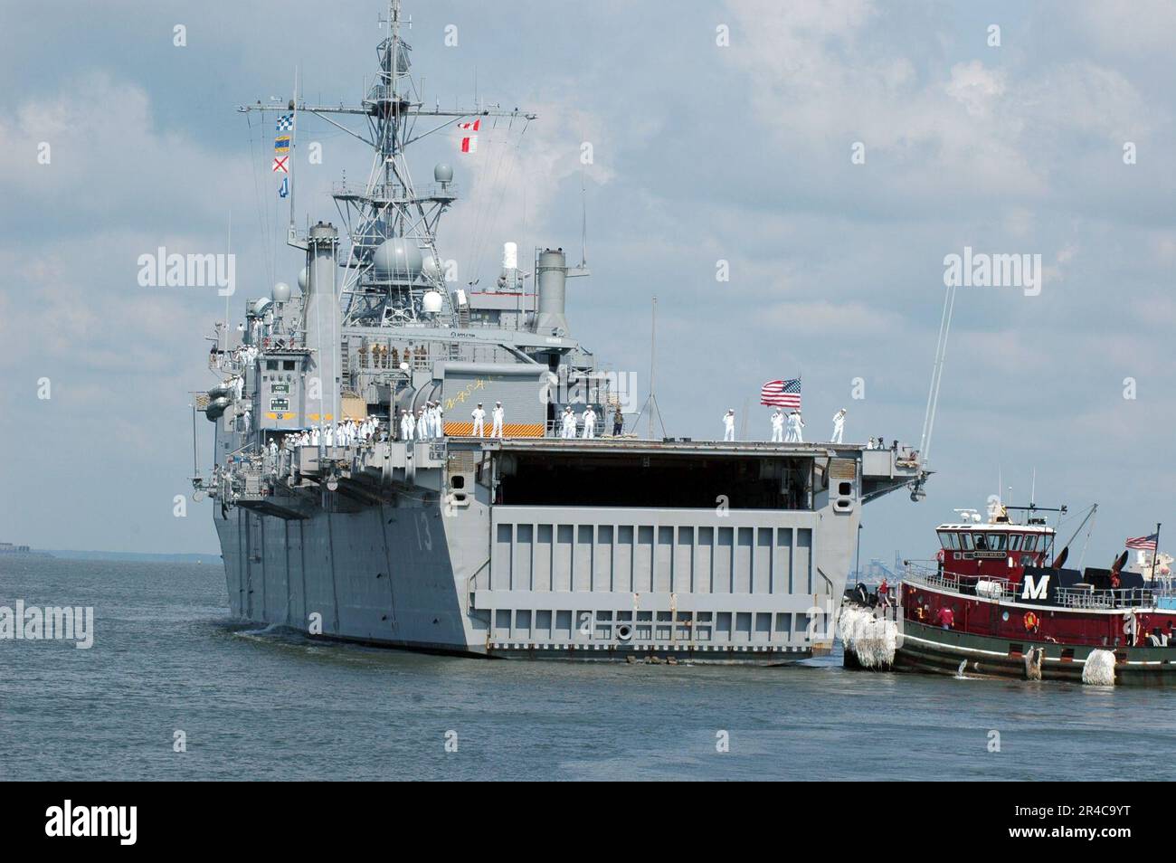 US Navy Sailors man the rails as the amphibious transport dock USS ...