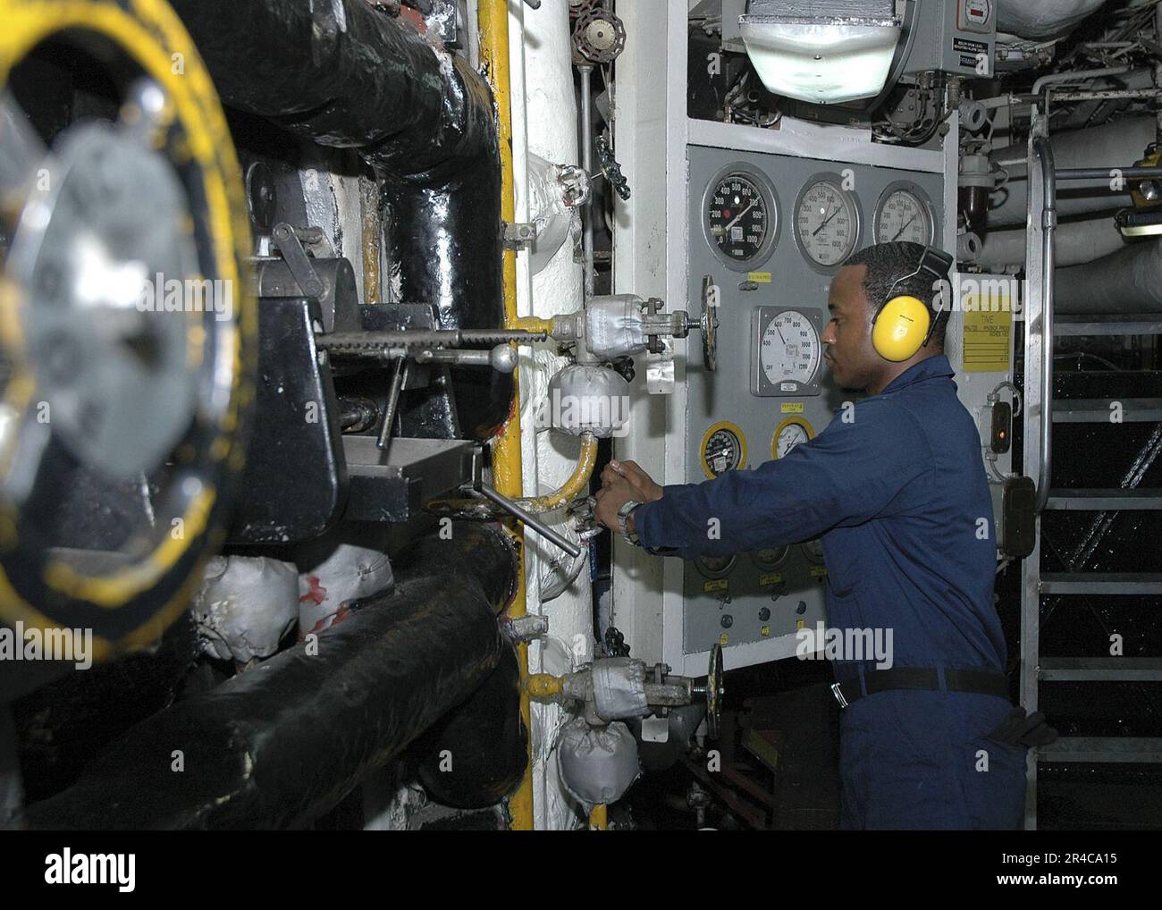 US Navy Engineman 3rd Class makes an adjustment to the ^1 Main ...