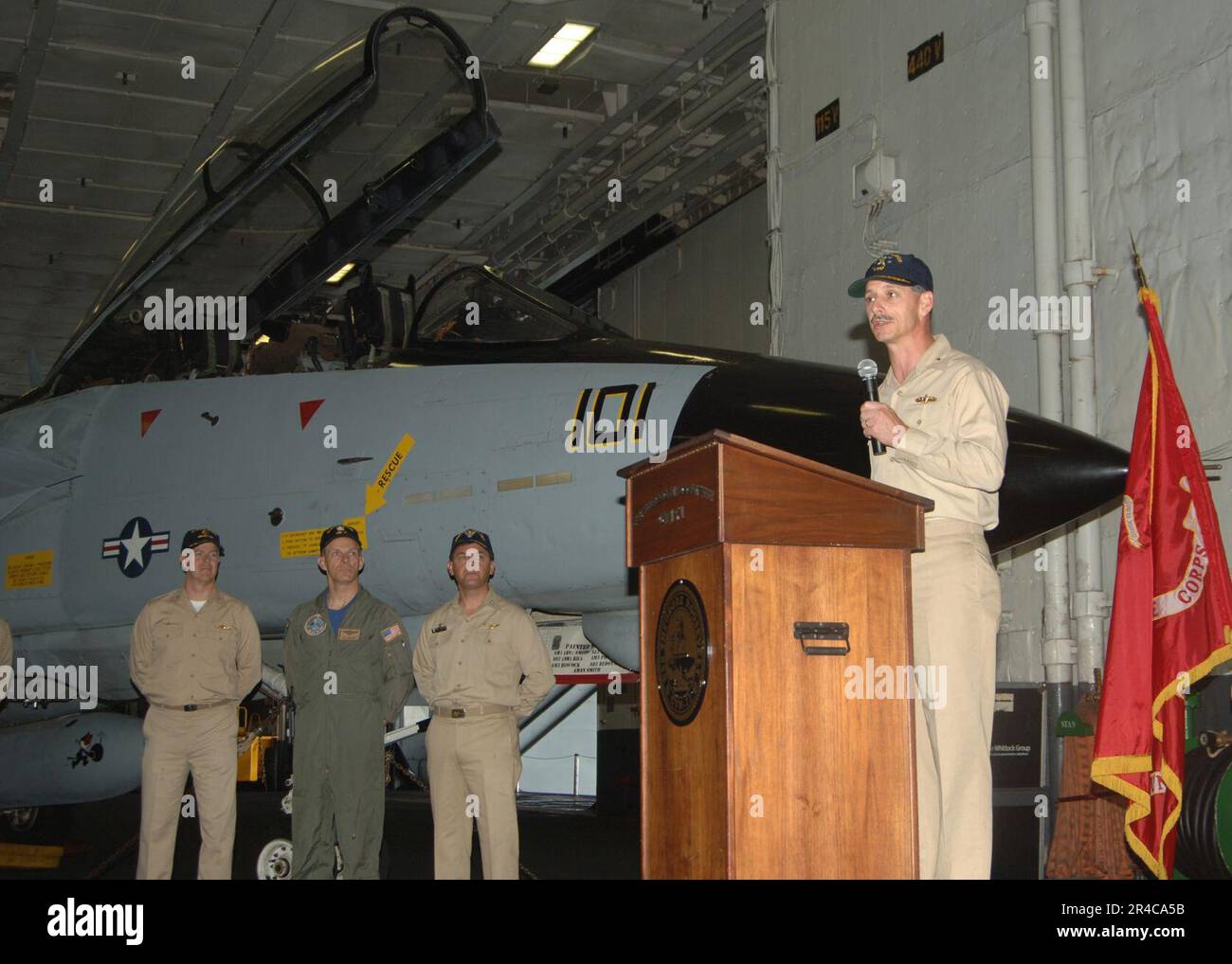 US Navy Rear Adm. Michael Vitale speaks to crew members after assuming ...