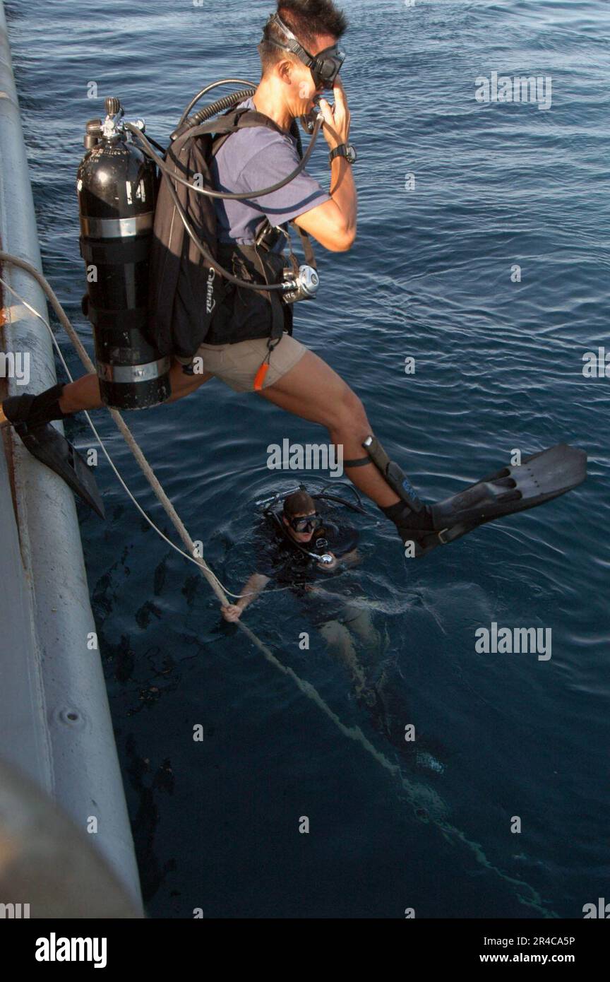 US Navy Cpl. from the Republic of Singapore Navy (RSN) steps off the ...