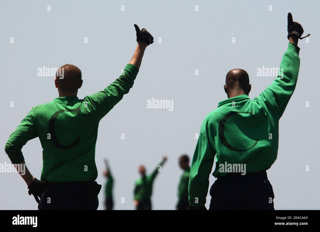 US Navy Aviation Boatswain's Mates signal a no-load launch of catapult ...