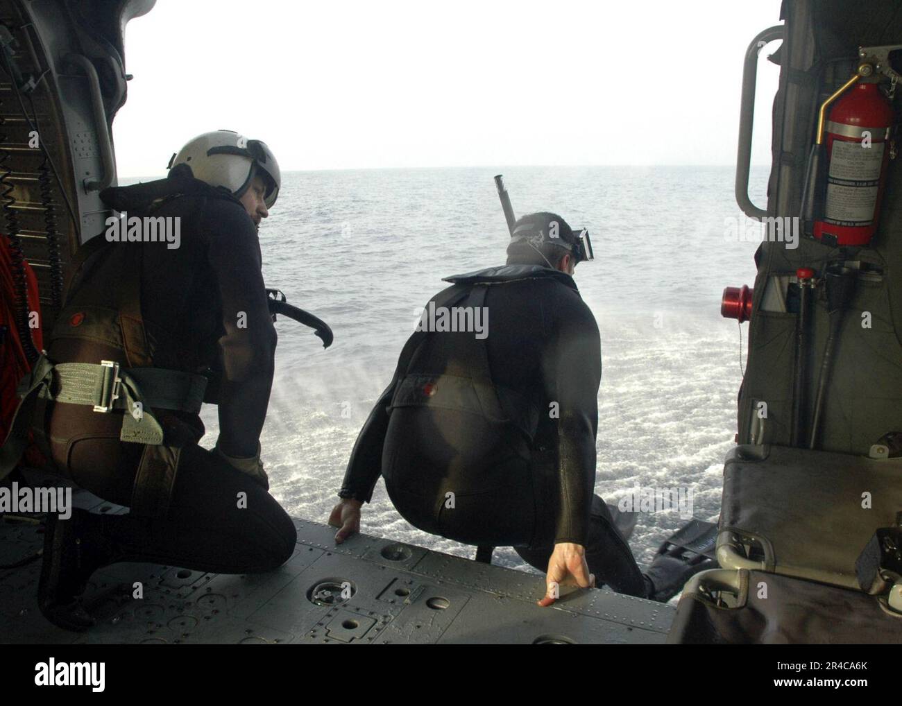 US Navy Air Warfare System's Operator 2nd Class, pushes himself out of ...