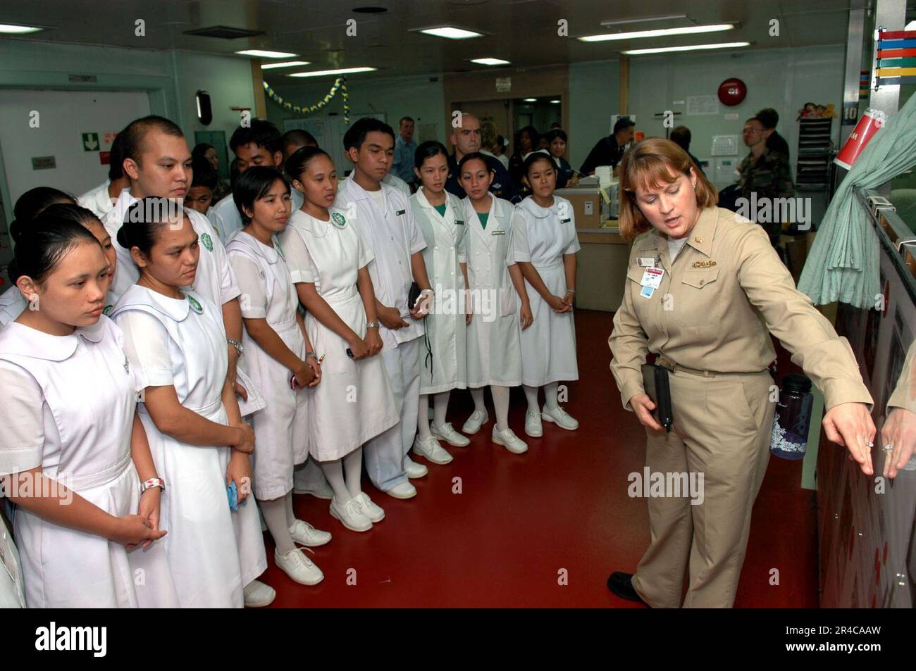 US Navy Navy Cmdr. conducts a tour to nursing students from the Jolo ...