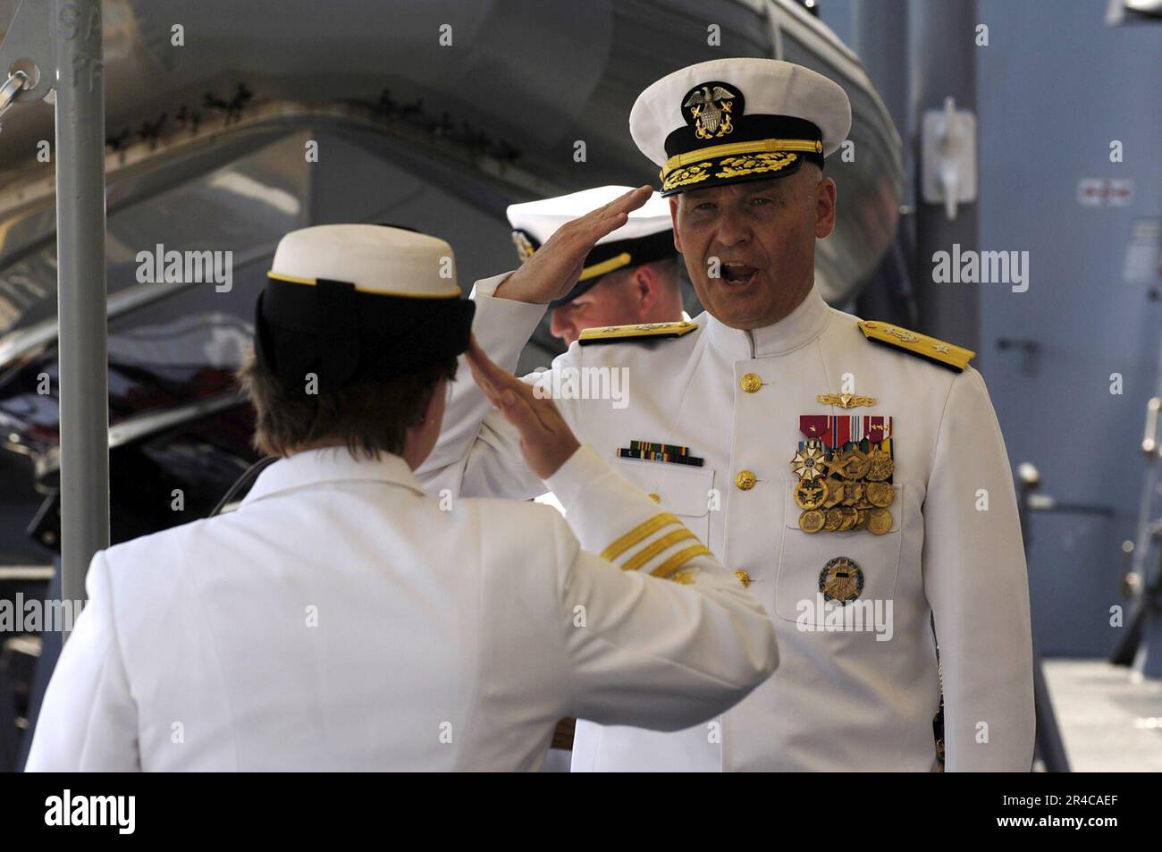 US Navy Cmdr. salutes Deputy Director, Surface Warfare, Rear Adm. Mark ...