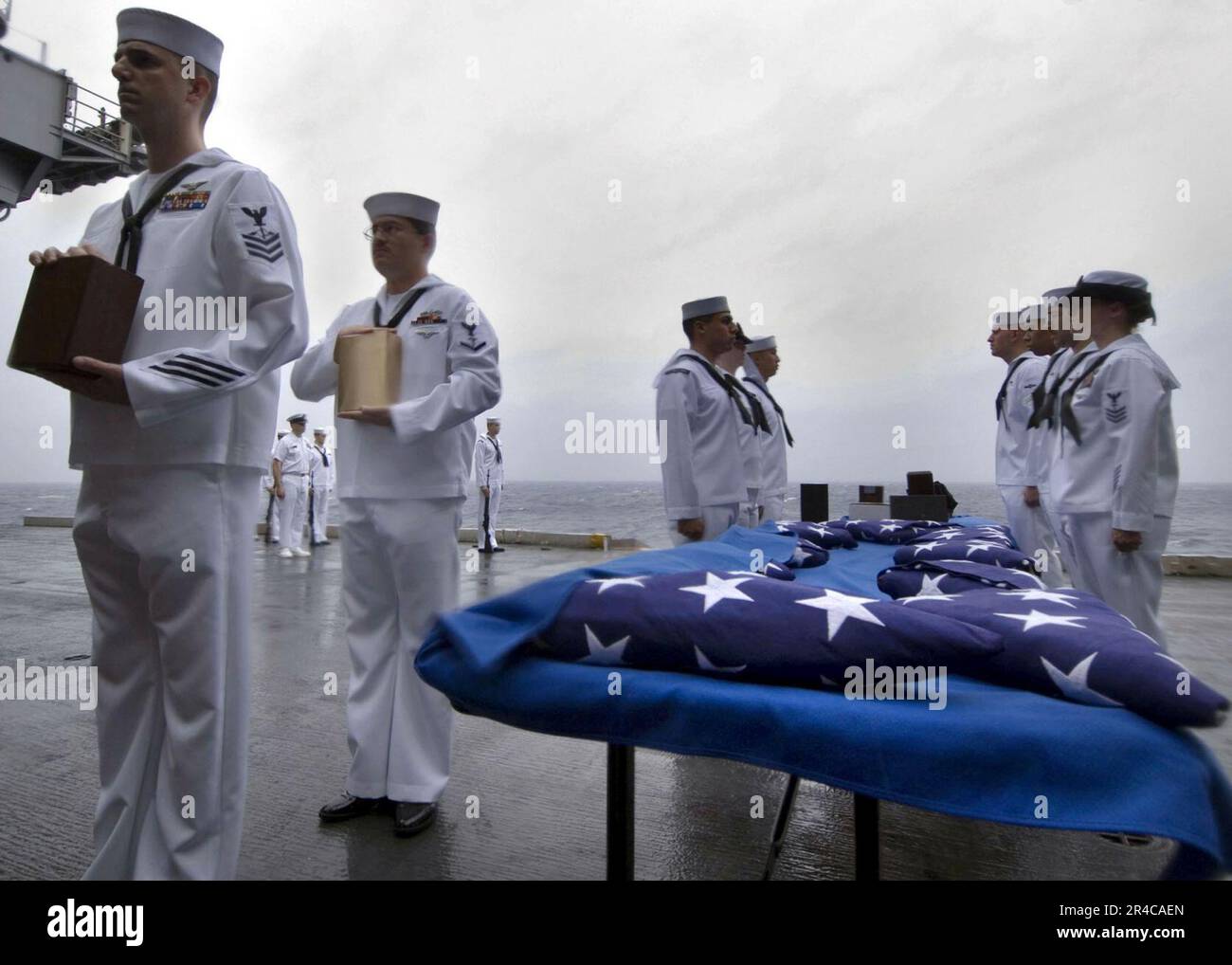 US Navy Sailors prepare to cast the ashes of deceased U.S. Navy ...