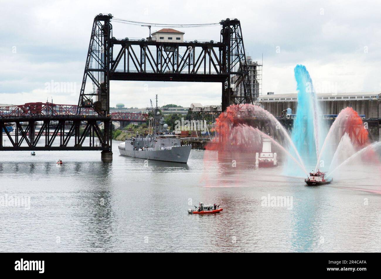 US Navy A Portland fire boat greets the guided-missile frigate USS ...