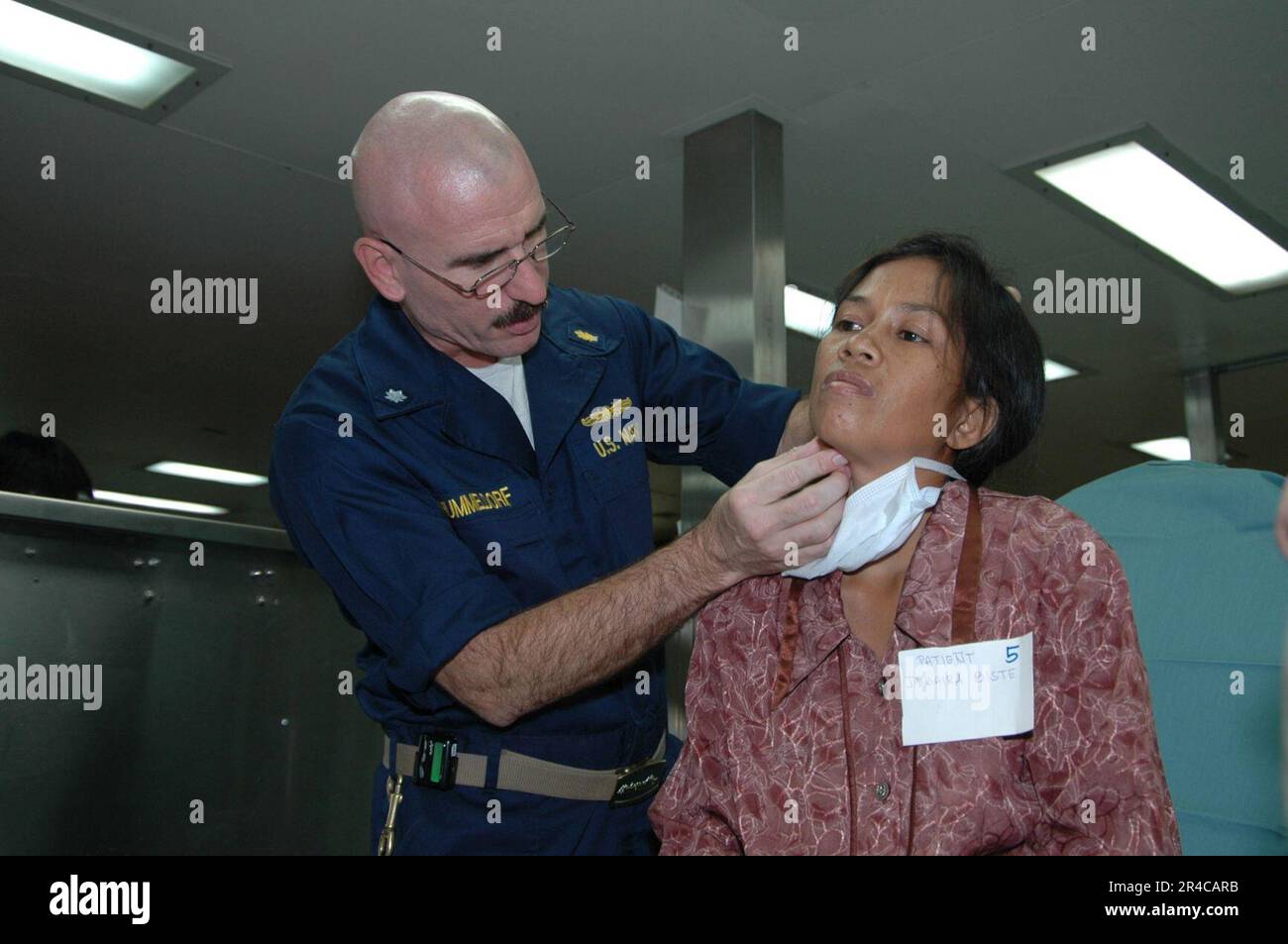 US Navy Navy Cmdr. a maxillofacial surgeon with the Medical Treatment ...