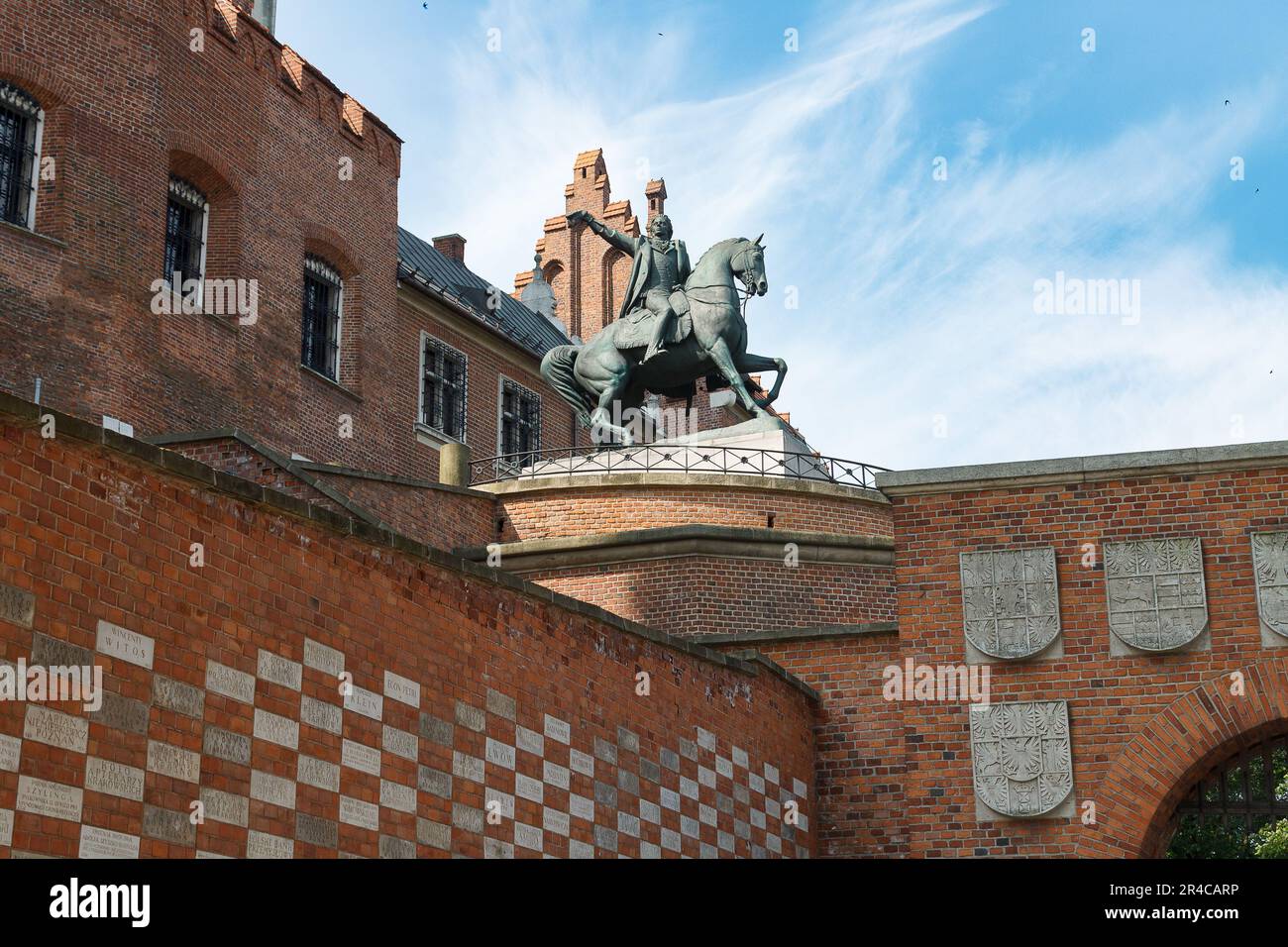 A large bronze statue of a horseman mounted on a horse stands on a ...