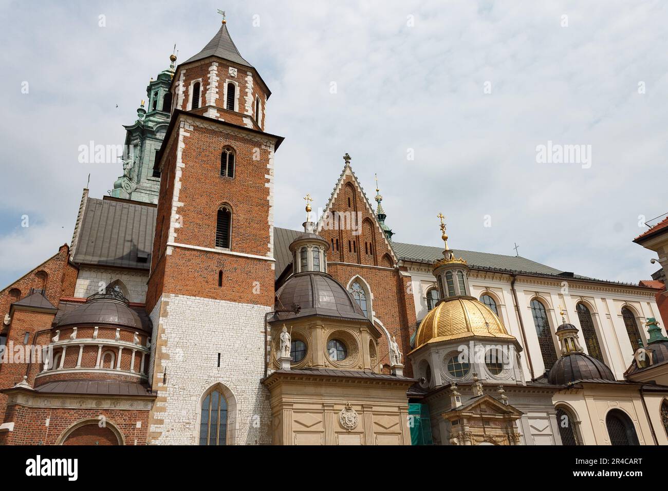 Two adults walking in front of a majestic castle-style building with ...