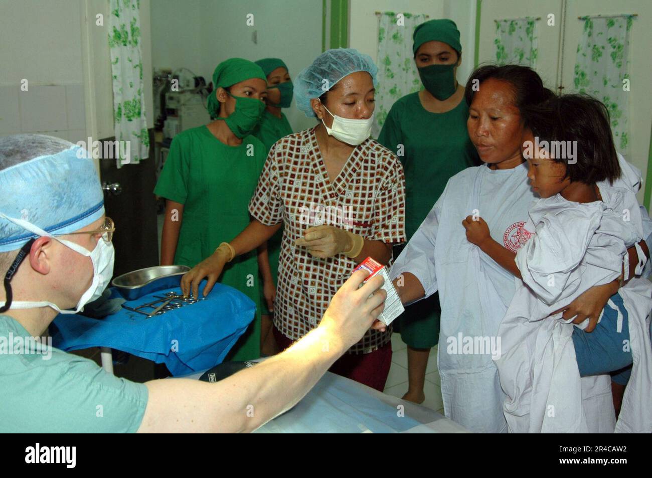 US Navy Navy Lt. Cmdr. a surgeon with the Medical Treatment Facility aboard the U.S. Military ...