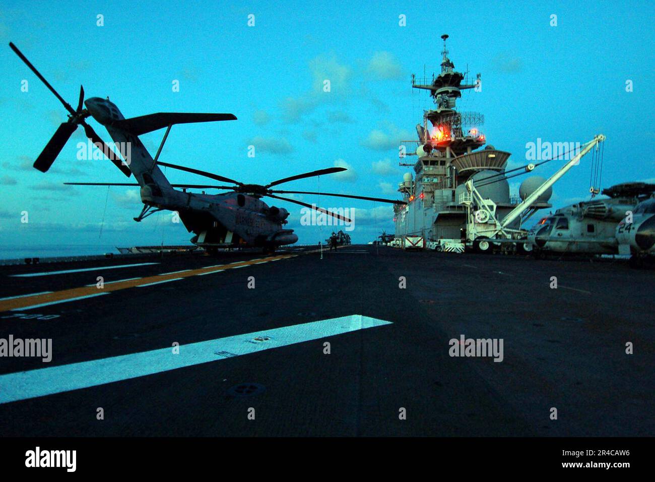 US Navy A CH-53E Sea Stallion sits on the flight deck of the multi ...