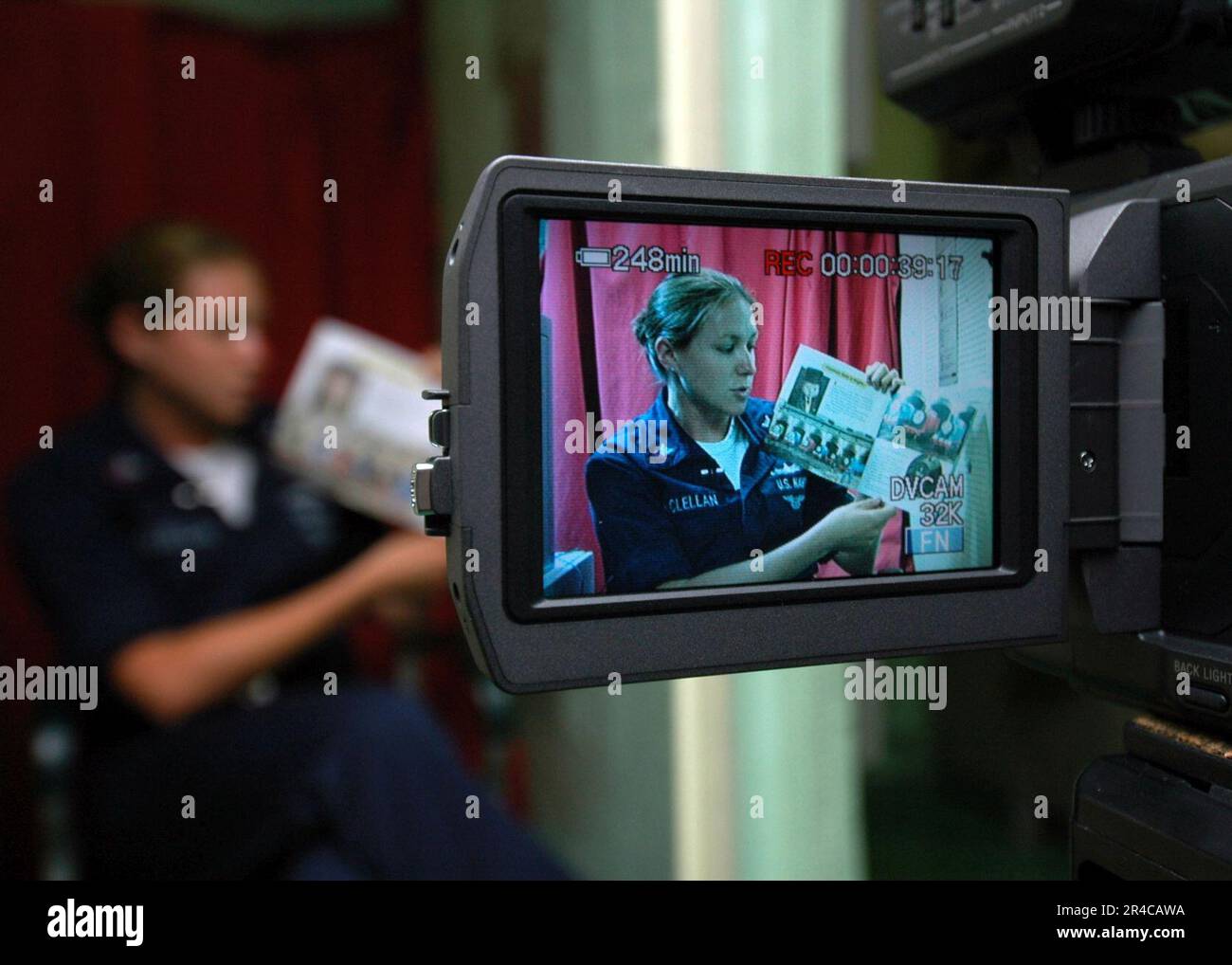 US Navy Fire Controlman 2nd Class reads to her son through the United ...