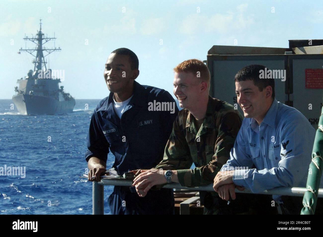 US Navy Sailors aboard USS Kitty Hawk (CV 63) watch as the ship ...