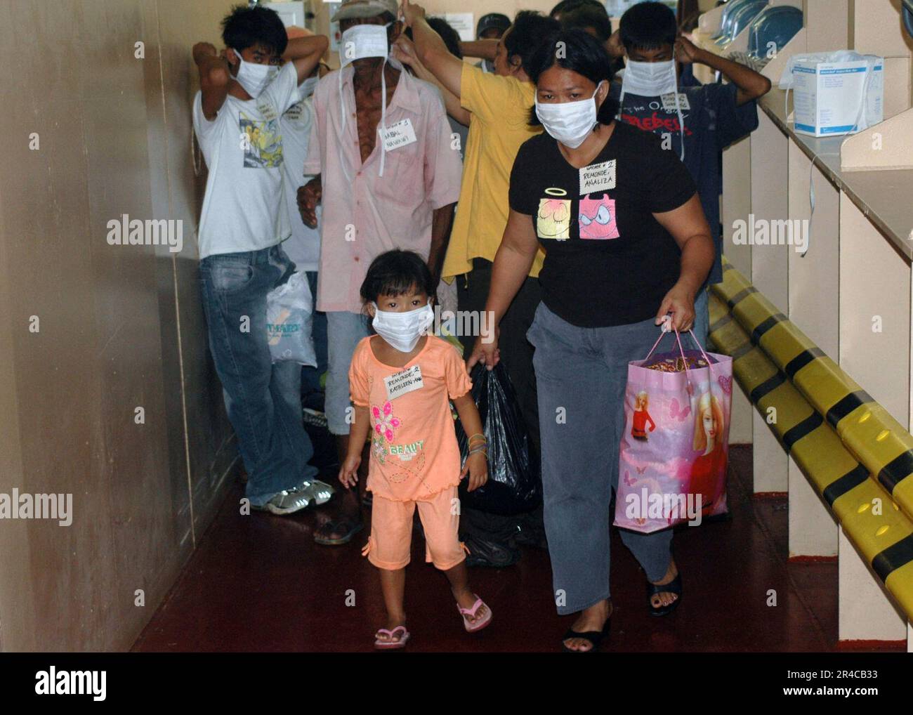 US Navy Patients don mask and began their walk up a ramp to medical ...