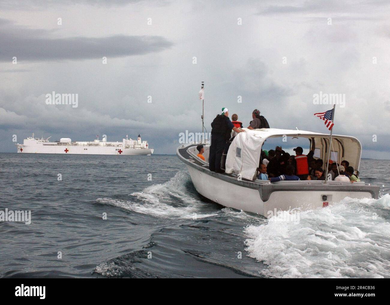 US Navy Patients travel by whale boat to the medical treatment ...