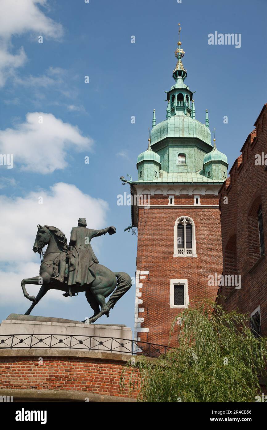 The Wavel royal castle in Krakow, Poland with a monument in front of ...