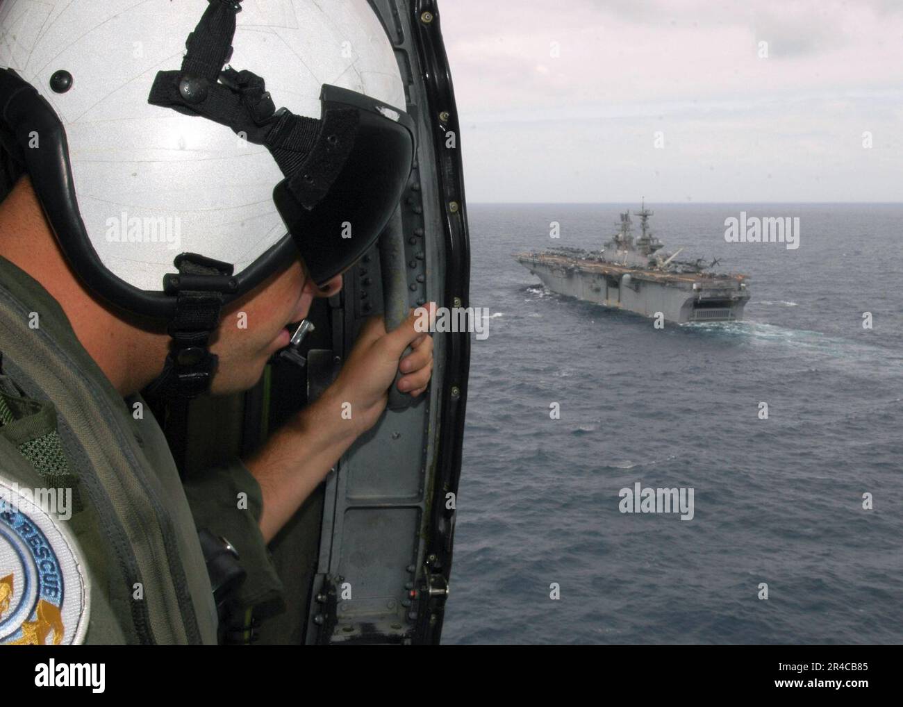 US Navy Aviation Warfare Technician 3rd Class prepares to spot for a ...