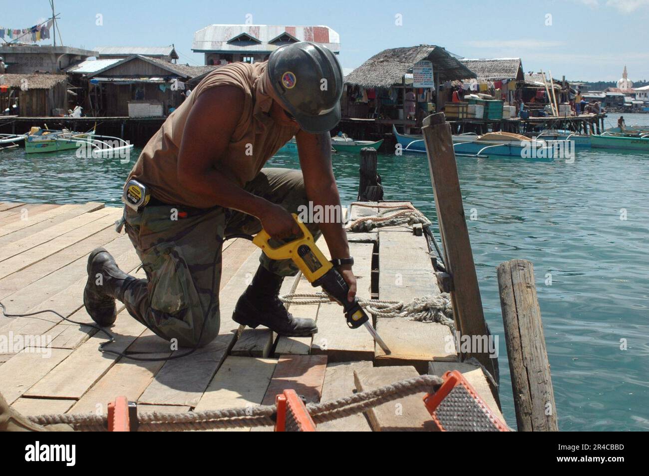 US Navy Navy Builder 3rd Class assigned to Naval Mobile Construction ...
