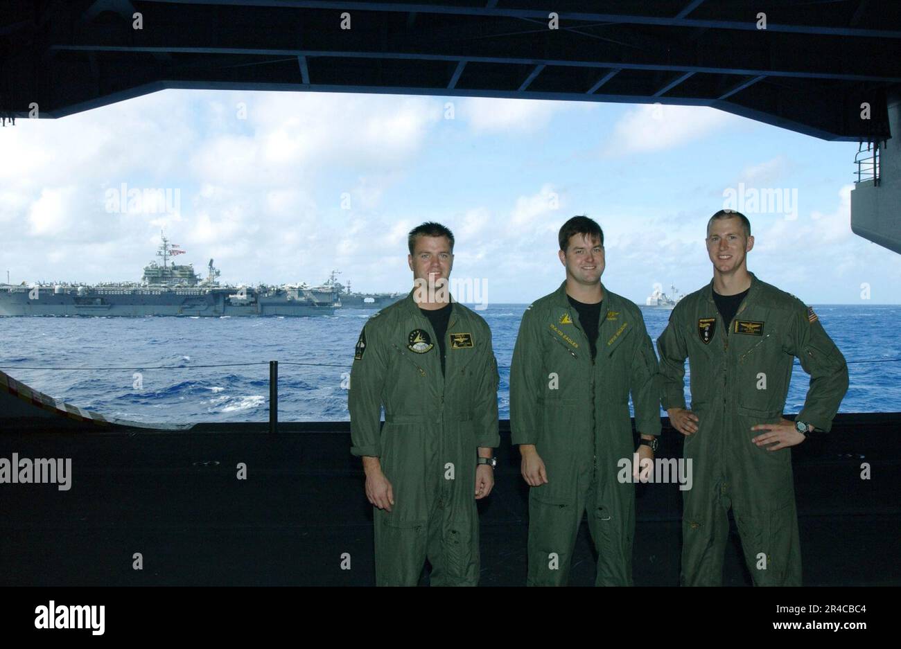 US Navy Lieutenants stand in the hangar bay aboard the Nimitz-class ...