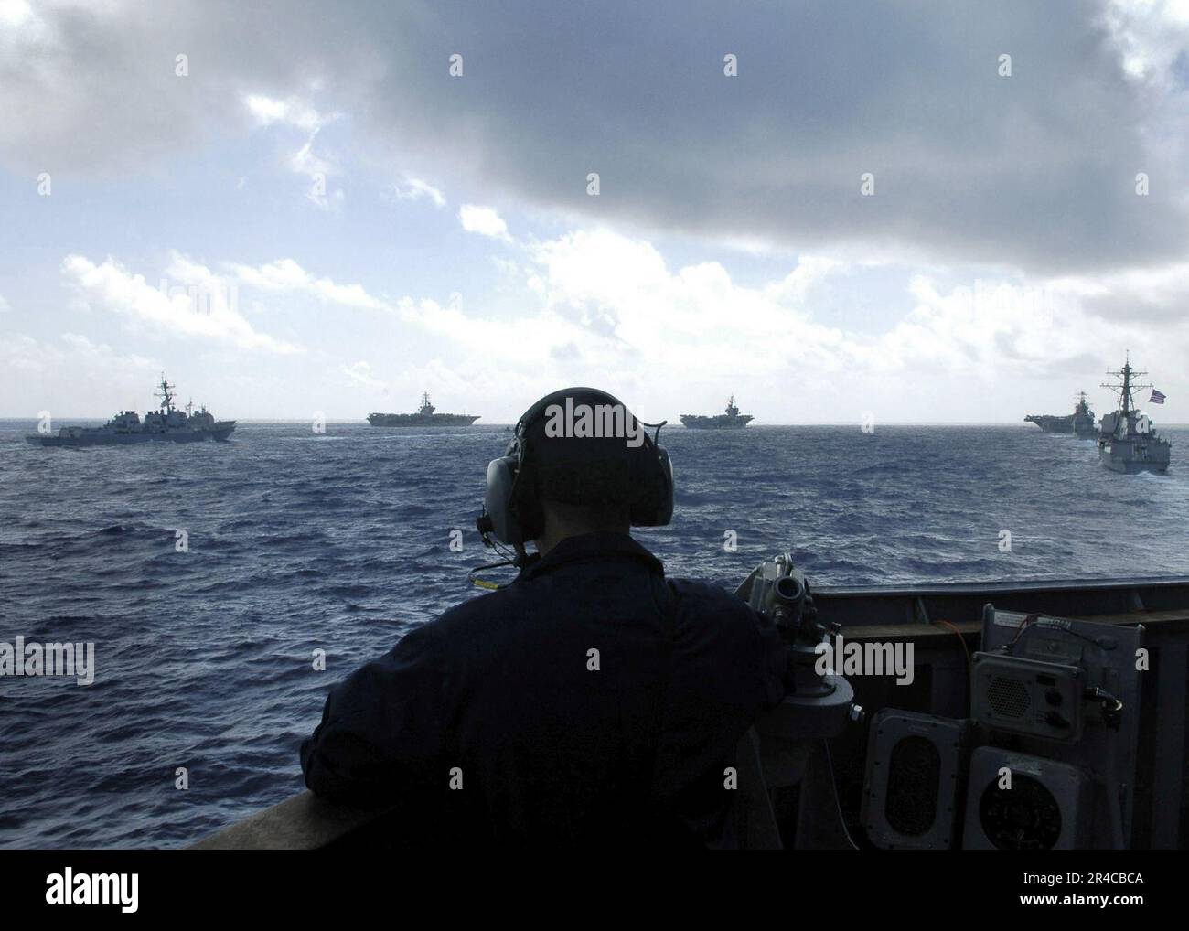 US Navy Boatswain's Mate 3rd Class stands the forward port lookout ...