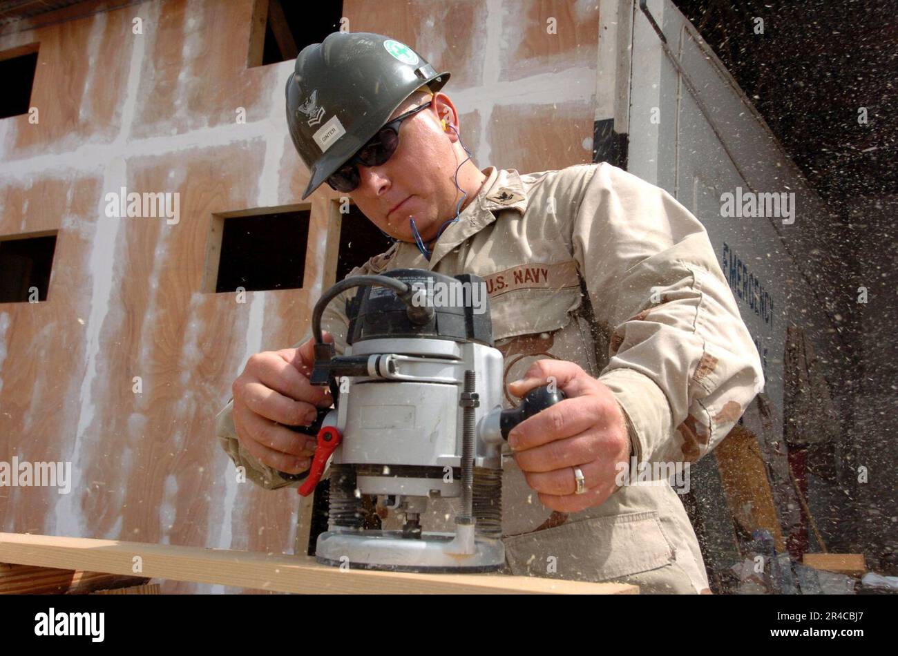 US Navy Builder 2nd Class assigned to Naval Mobile Construction ...