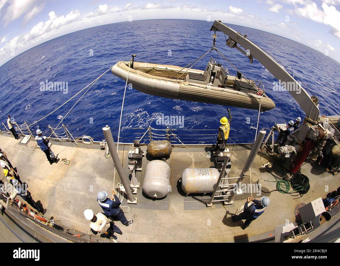 US Navy Sailors launch the Rigid Hull Inflatable Boat (RHIB) to conduct ...