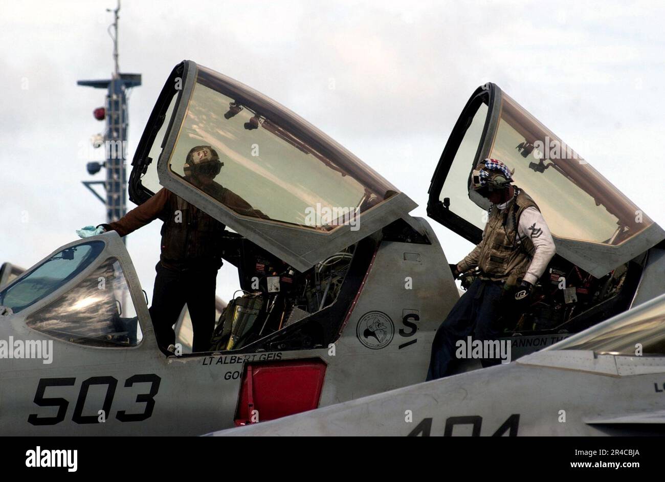 US Navy Sailors perform maintenance in the cockpit of an EA-6B Prowler ...