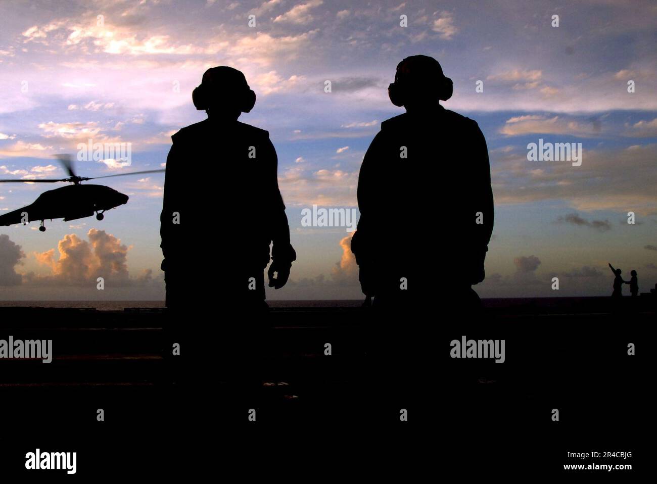US Navy An SH-60F Seahawk lands prior to the beginning of night flight ...