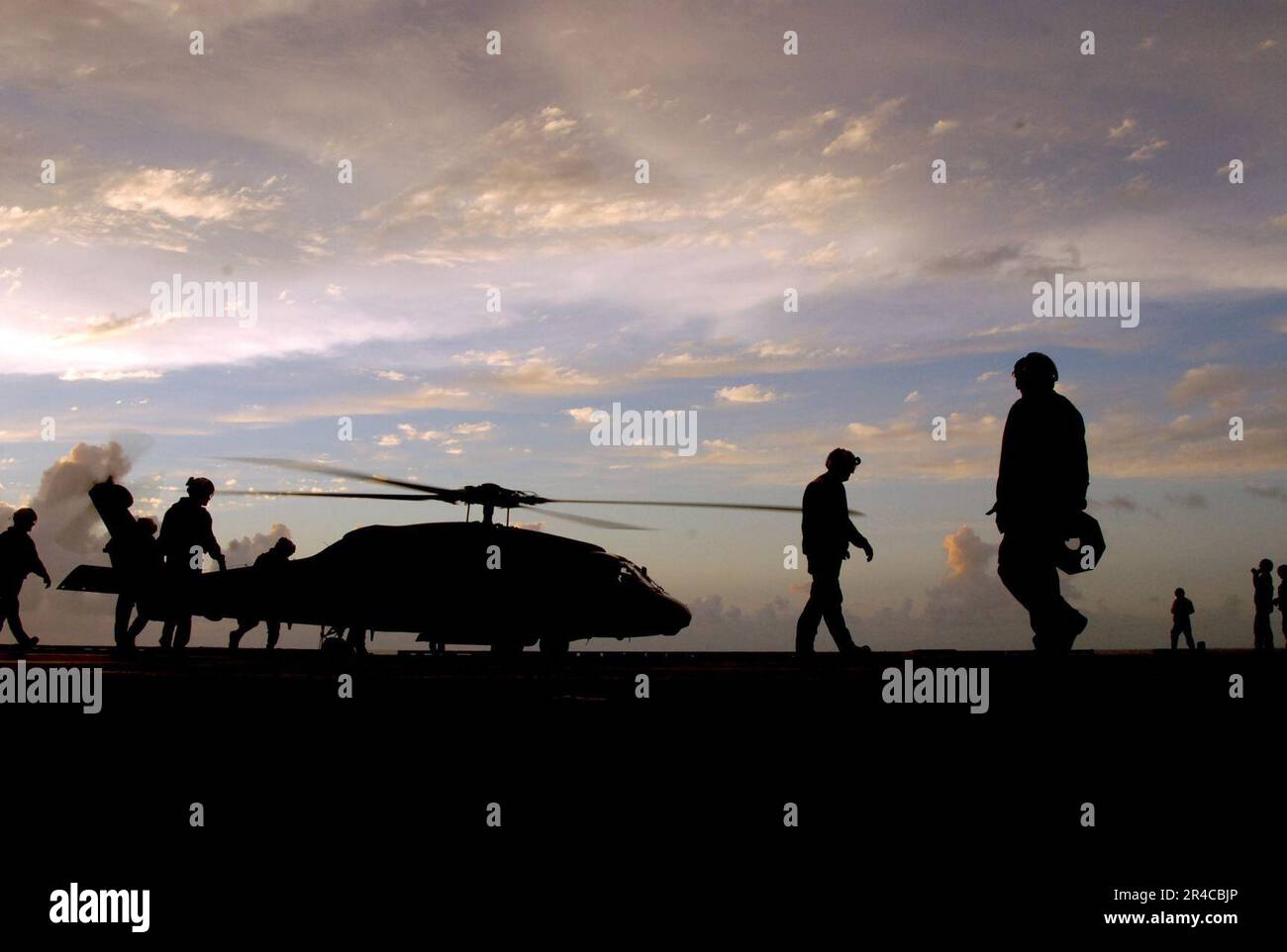US Navy An SH-60F Seahawk lands prior to the beginning of night flight ...