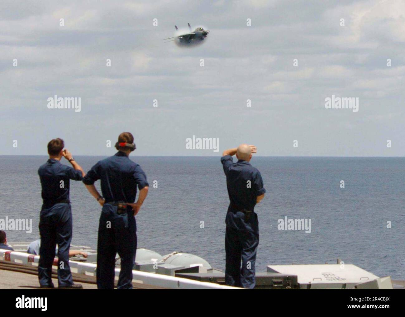 US Navy Sailors stationed aboard the Nimitz-class aircraft carrier USS ...