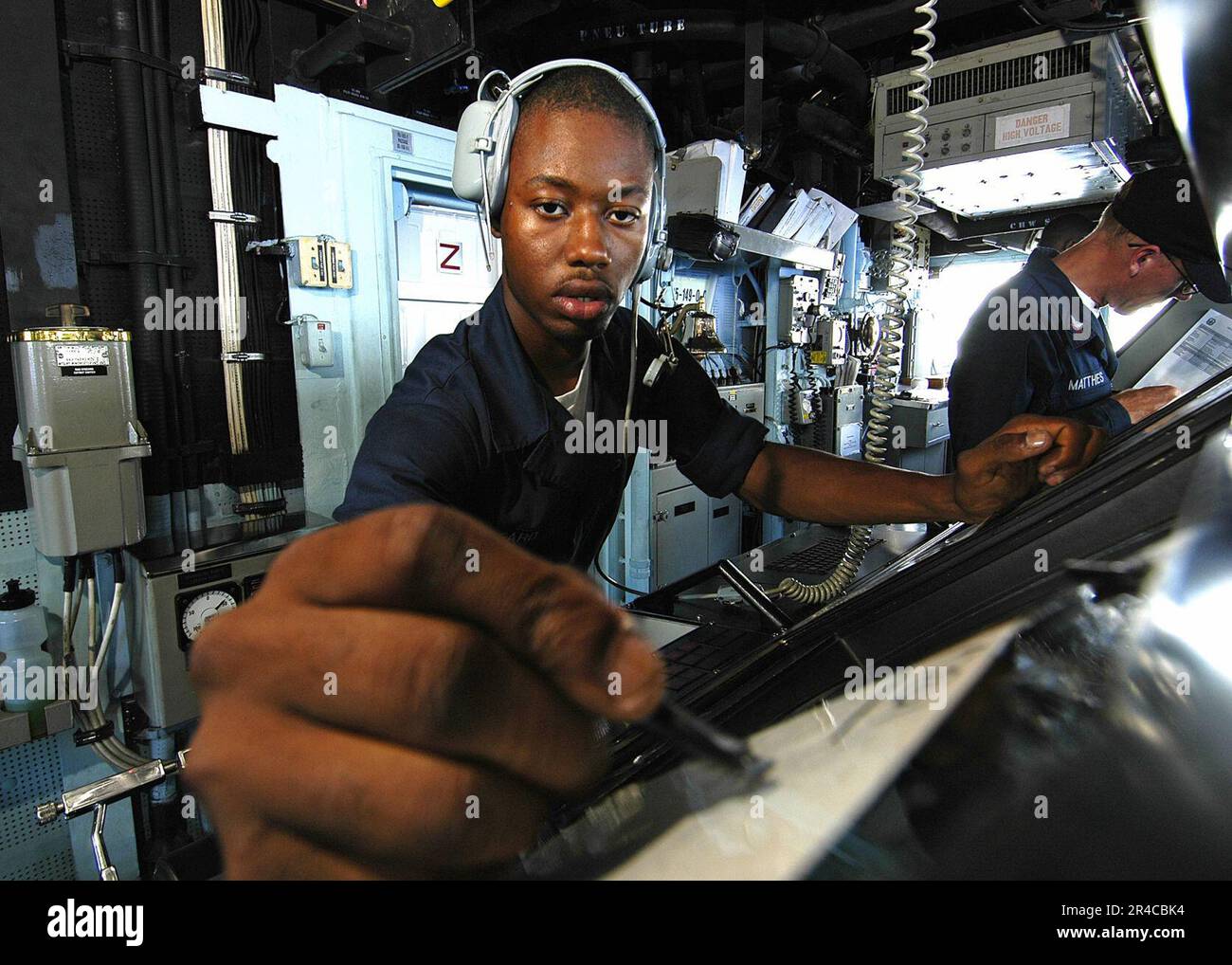 US Navy Seaman records course changes while standing helmsman aboard ...