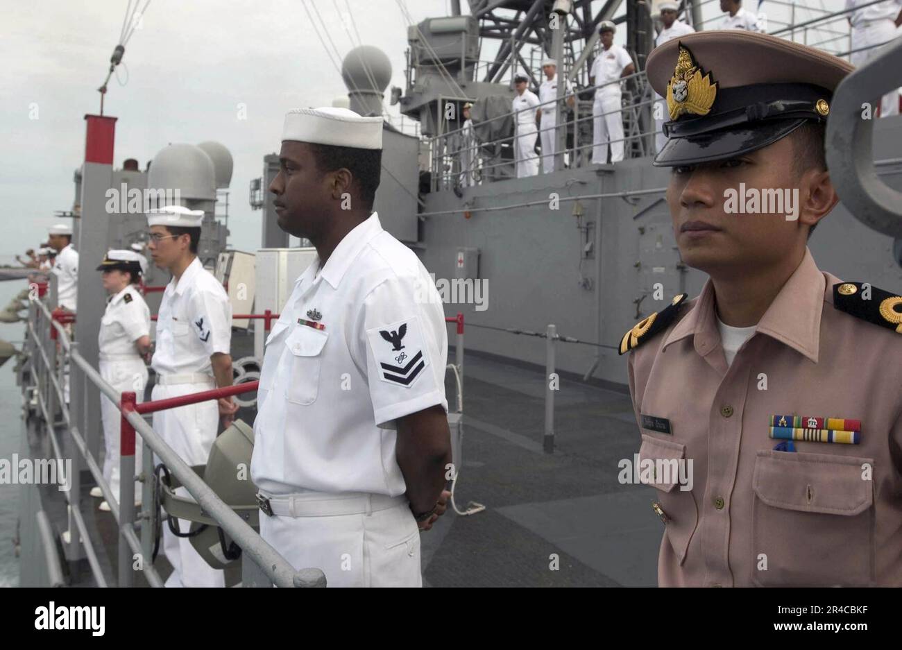 US Navy Royal Thai Navy Liaison Officer, Lt. right, stands with USS ...
